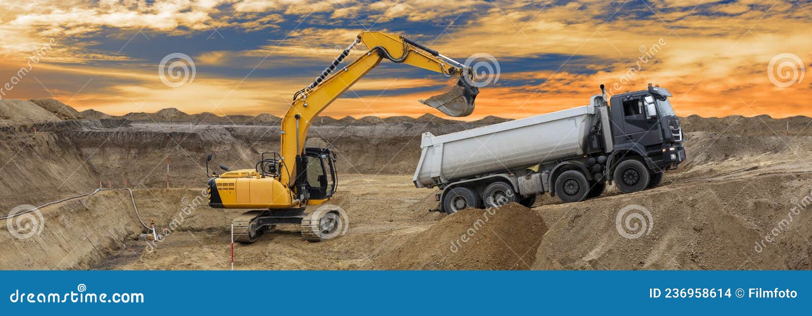 Digger and Excavator at Work in Construction Site Stock Photo - Image ...