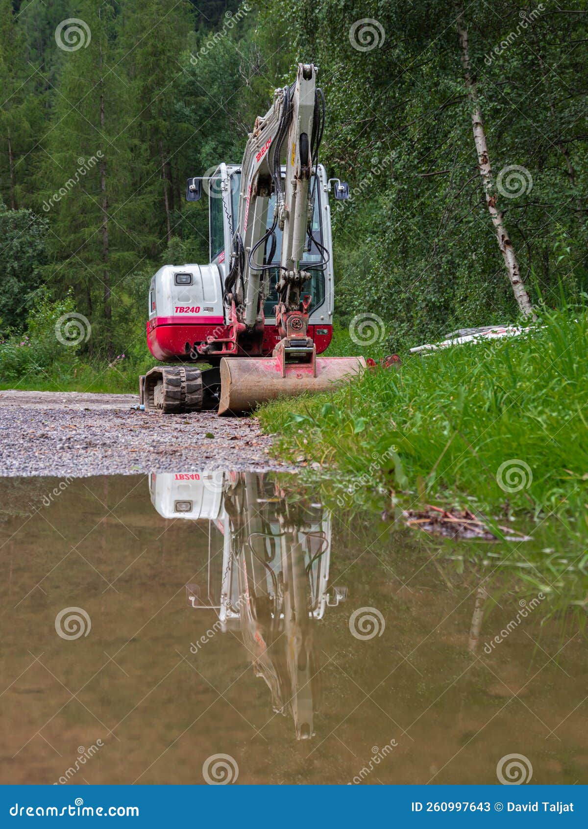 Digger and Its Reflection in Puddle Editorial Stock Photo - Image of ...
