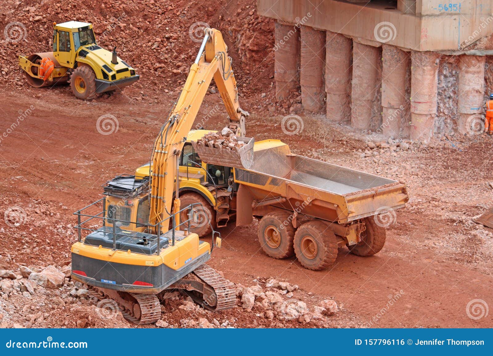 Digger Loading Trucks With Soil Stock Photo | CartoonDealer.com #39159336