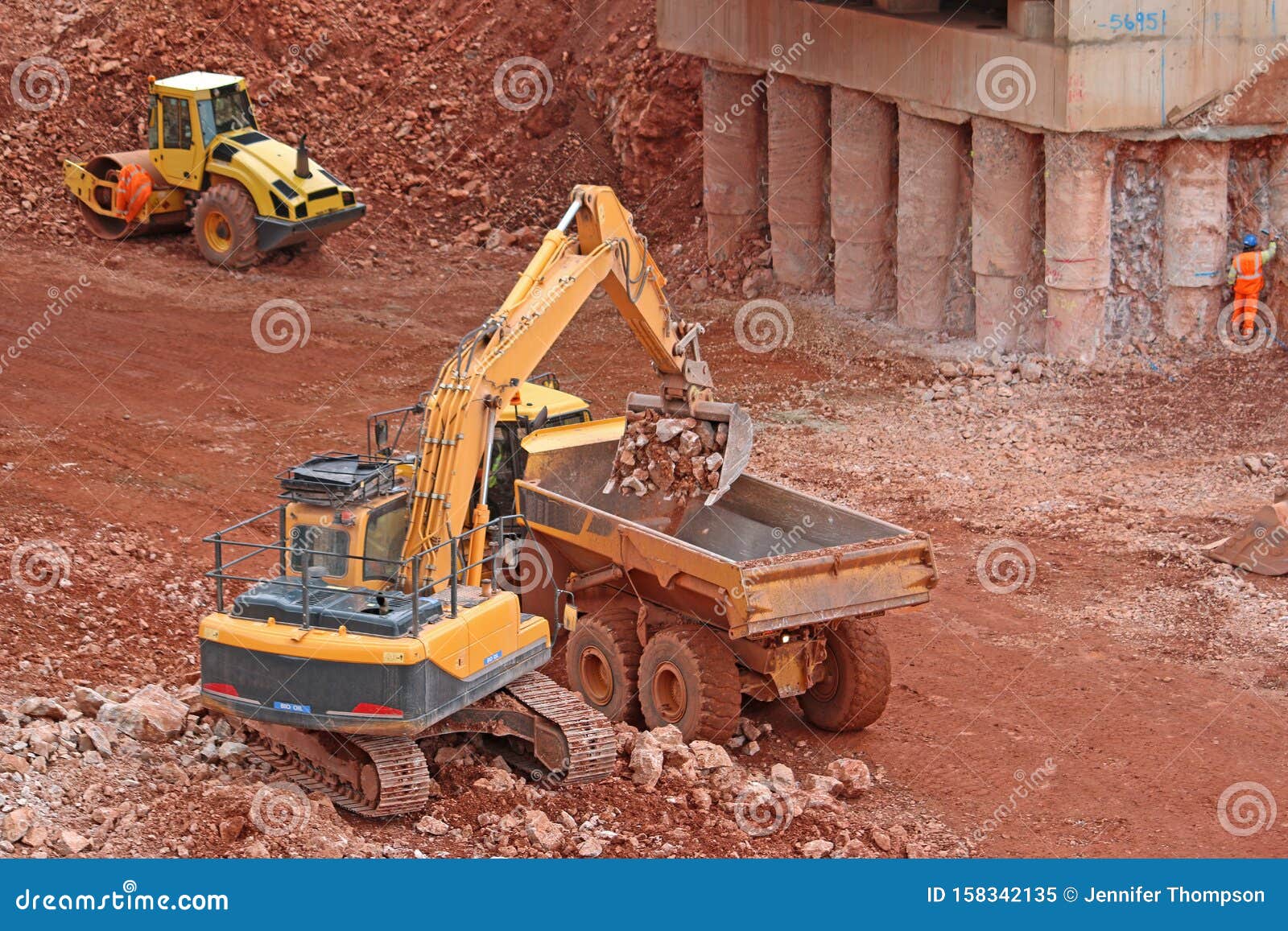 Digger Loading a Dump Truck Stock Image - Image of tracks, building ...