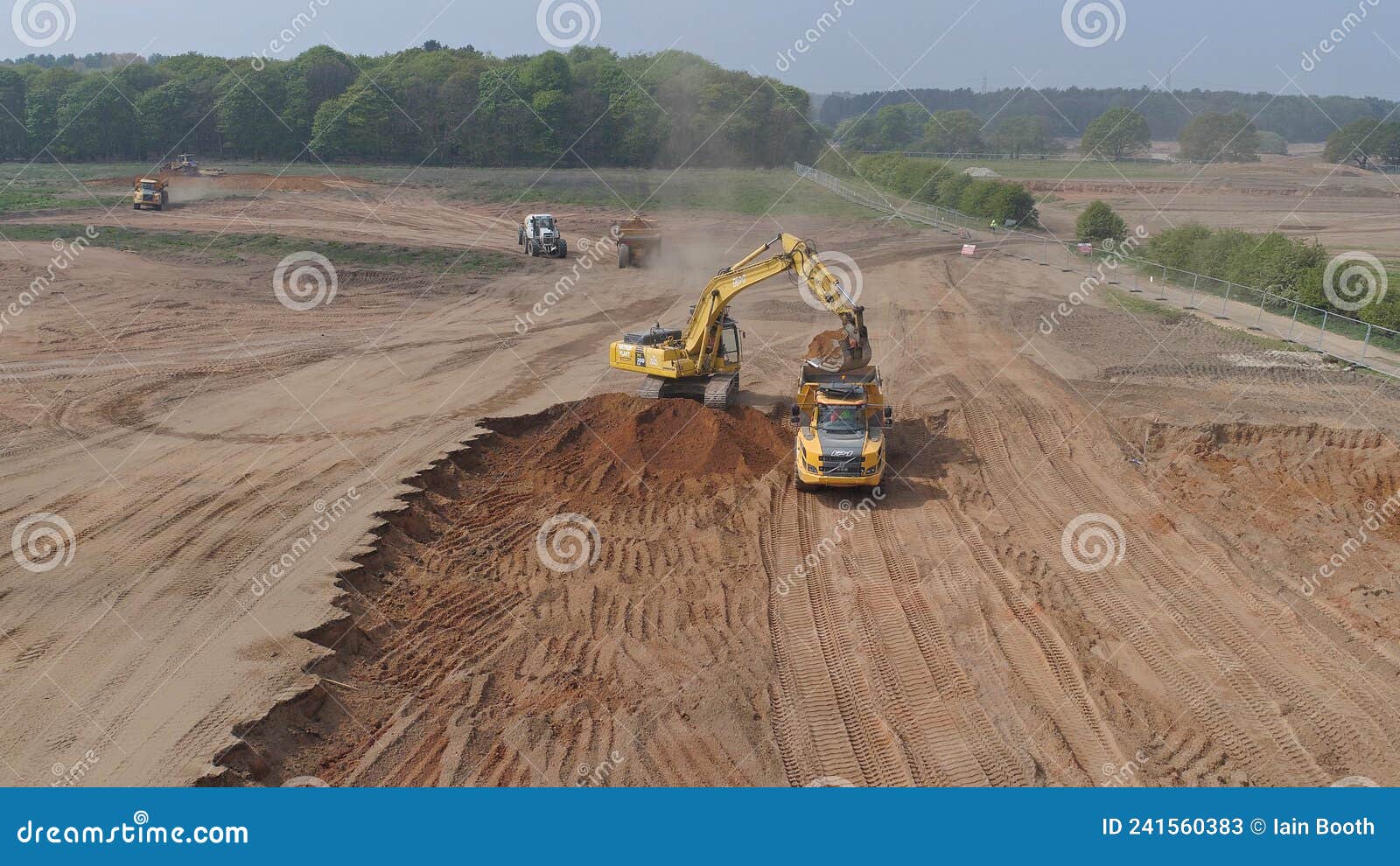 Digger Loading Earth into a Large Tipper Truck Editorial Stock Photo ...