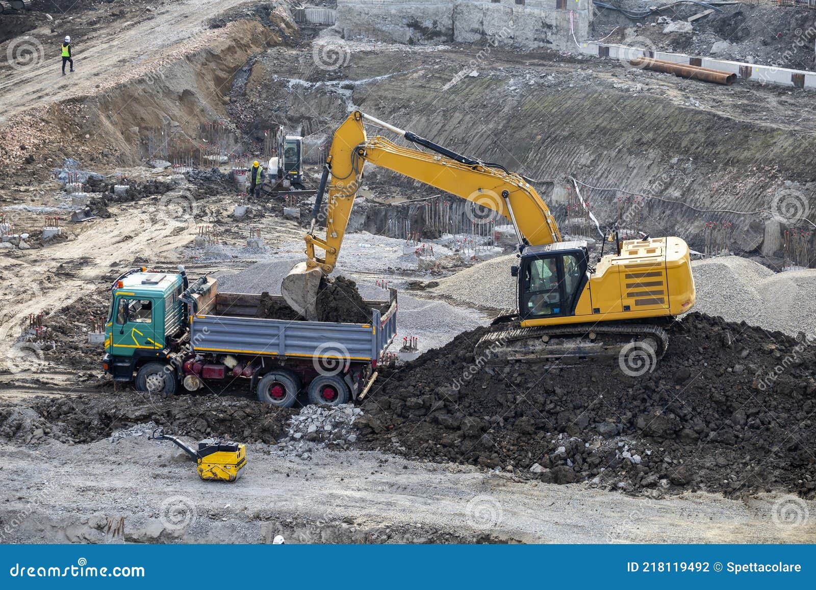 Digger Loading Trucks With Soil Stock Photo | CartoonDealer.com #39159336