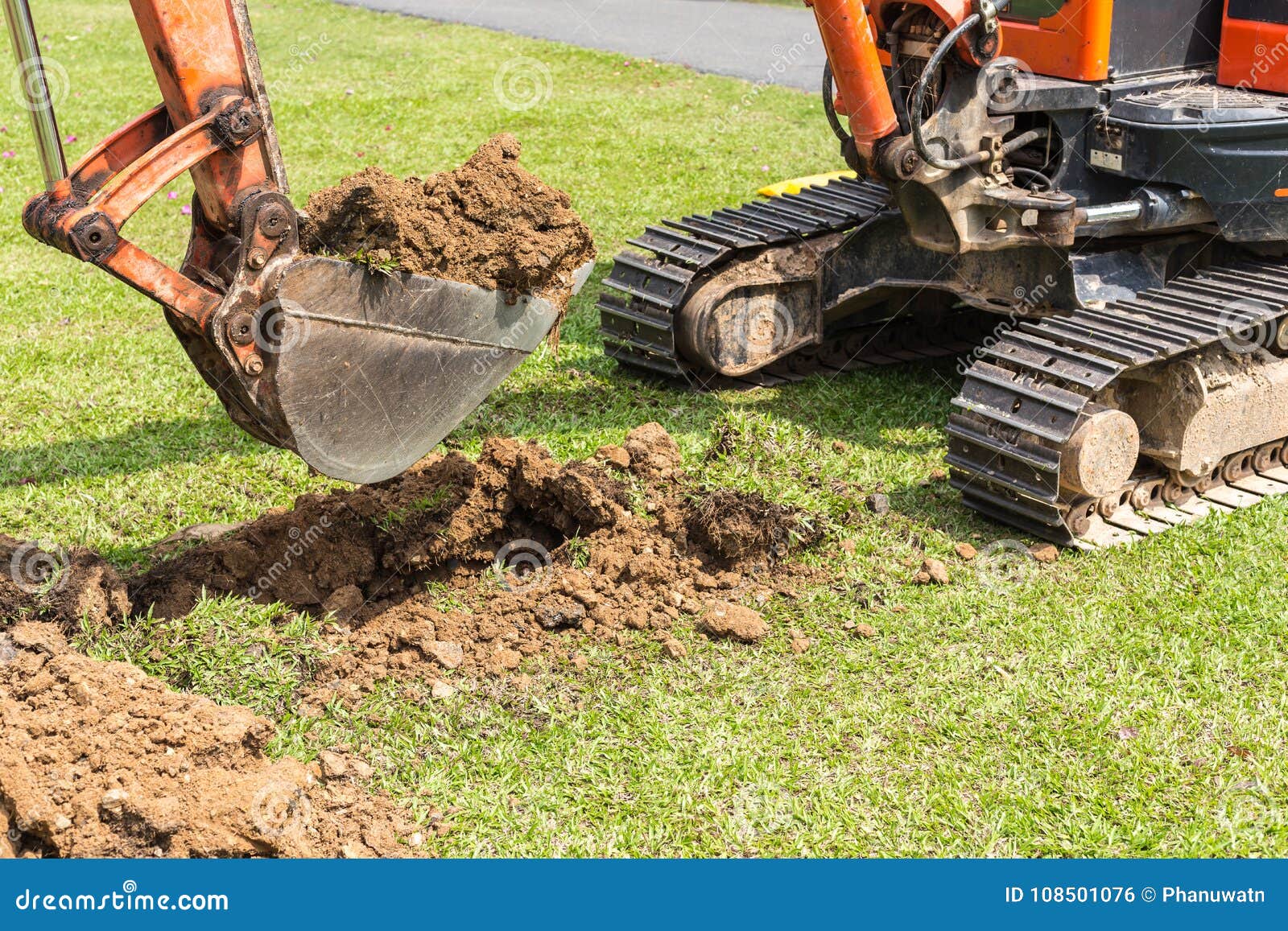 Digger Machine Operate for Digging Soil and Repair Road in the P Stock ...