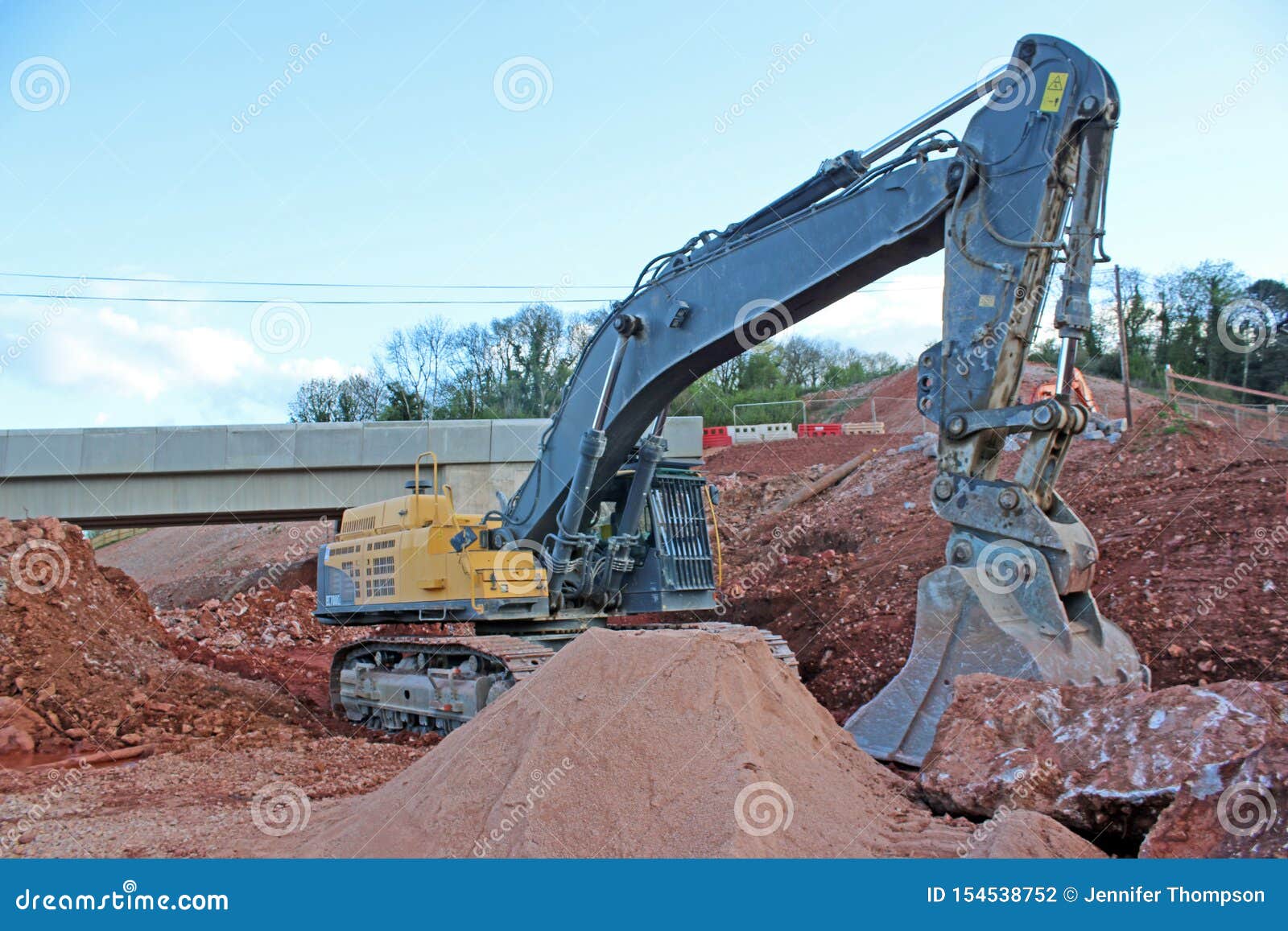 Digger on a Road Construction Site Stock Photo - Image of plant ...
