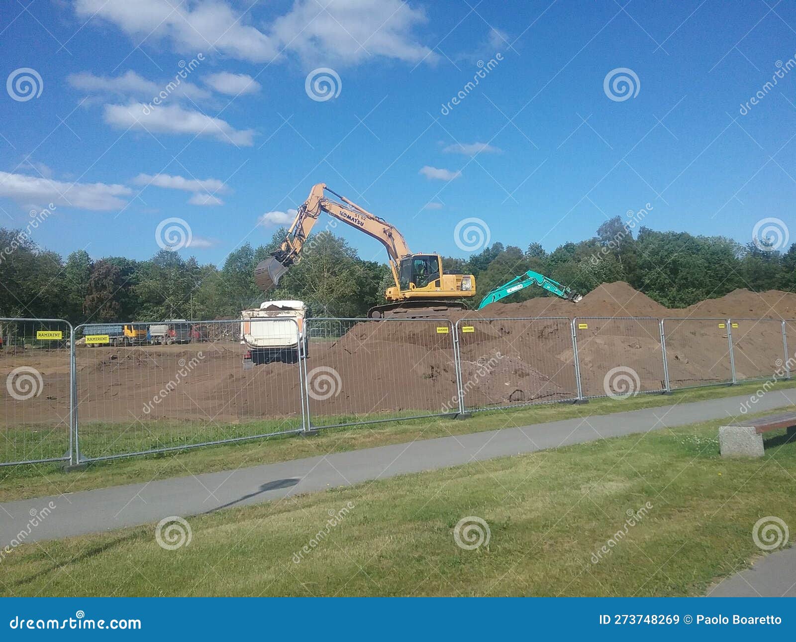 Digger and Truck Working in Excavation Pit Editorial Stock Image ...