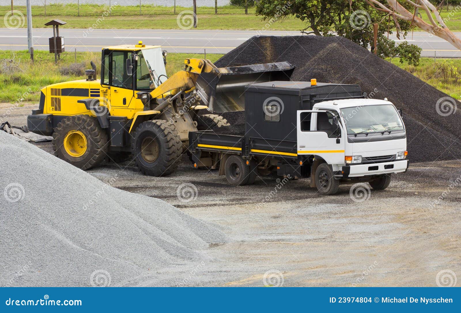 Digger and Truck Working with Gravel Stock Photo - Image of loading ...