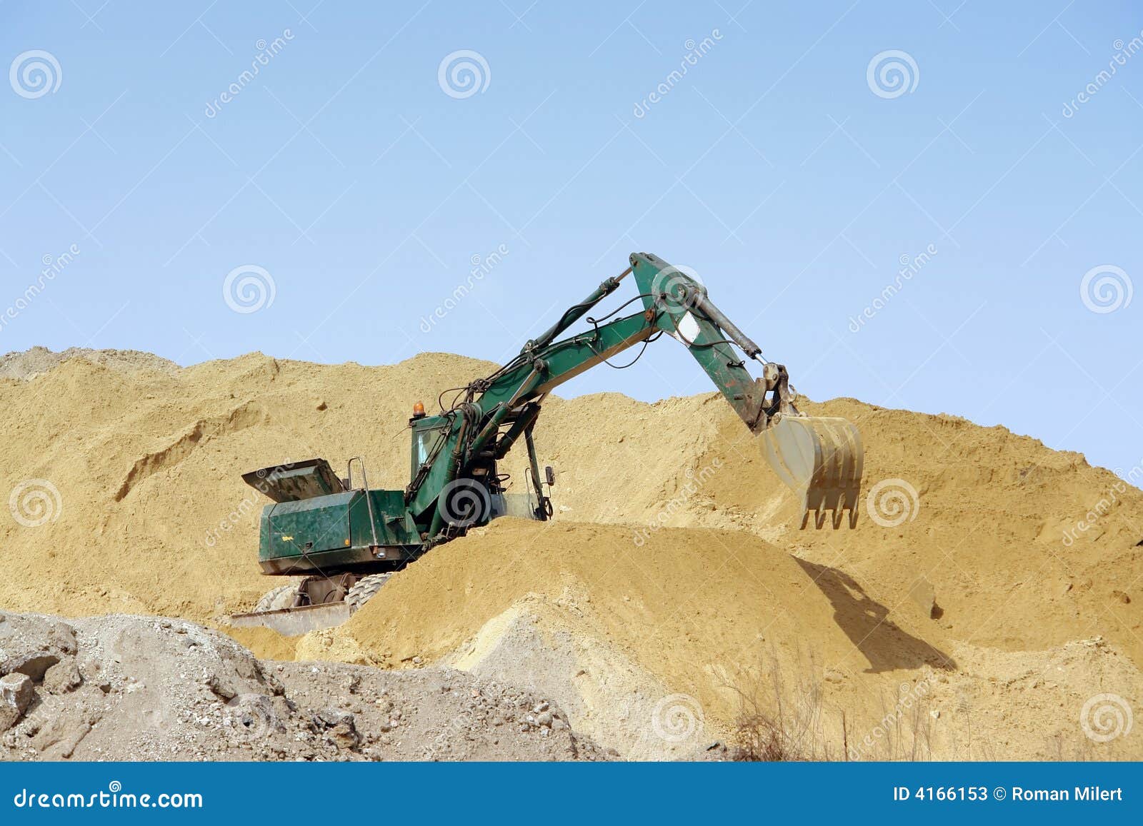 Digger at work stock image. Image of pile, earthwork, industrial - 4166153