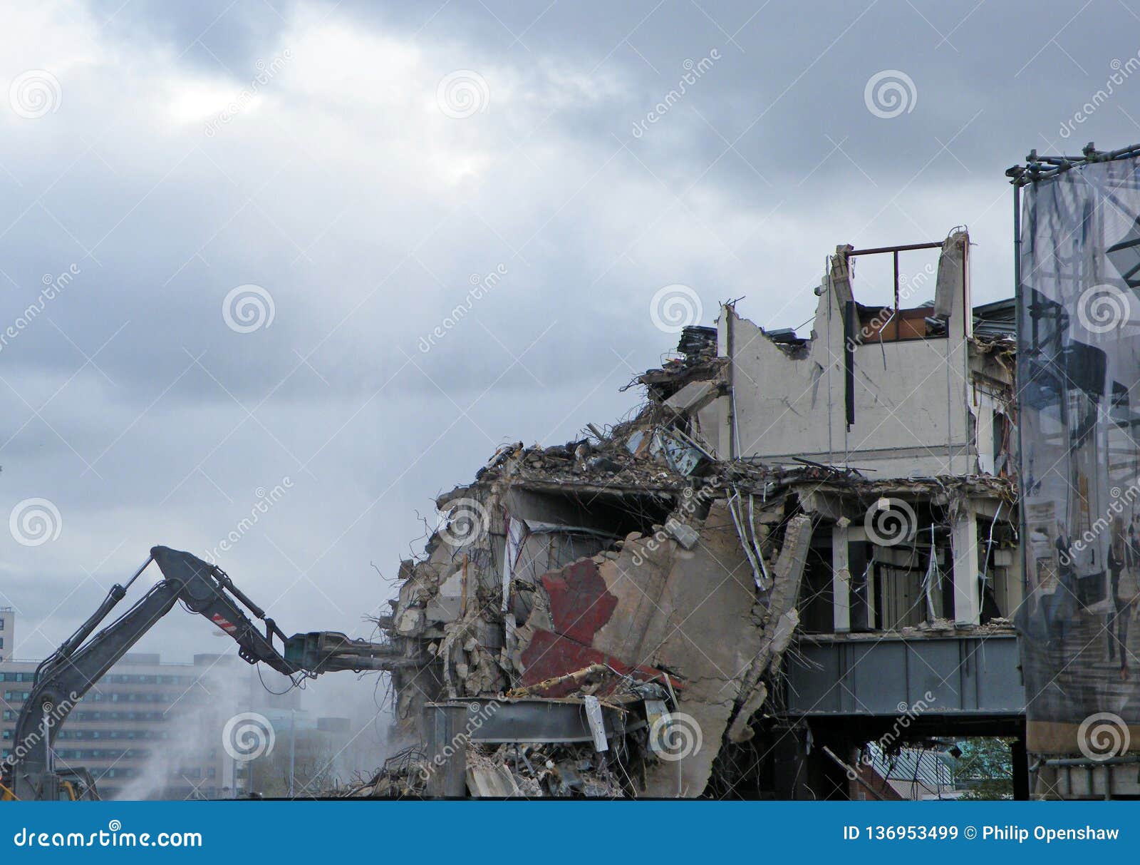Digger Working on a Demolition Site Destroying a Section of Wall ...