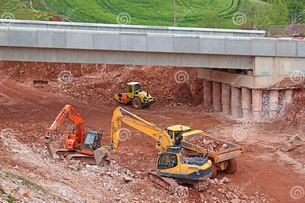 Diggers on a Road Construction Site Stock Image - Image of barriers ...