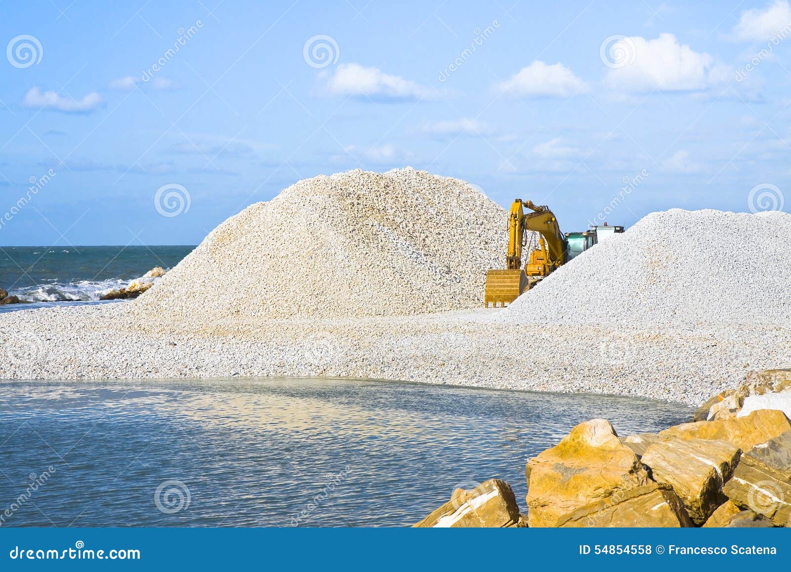 Diggers on the seashore stock photo. Image of machinery - 54854558