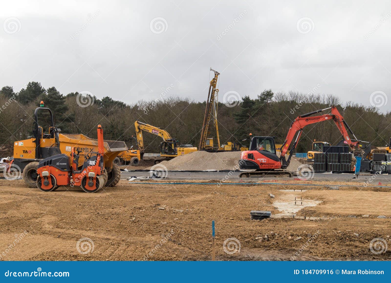 Diggers and Dumper Trucks on a Construction Site Editorial Photo ...