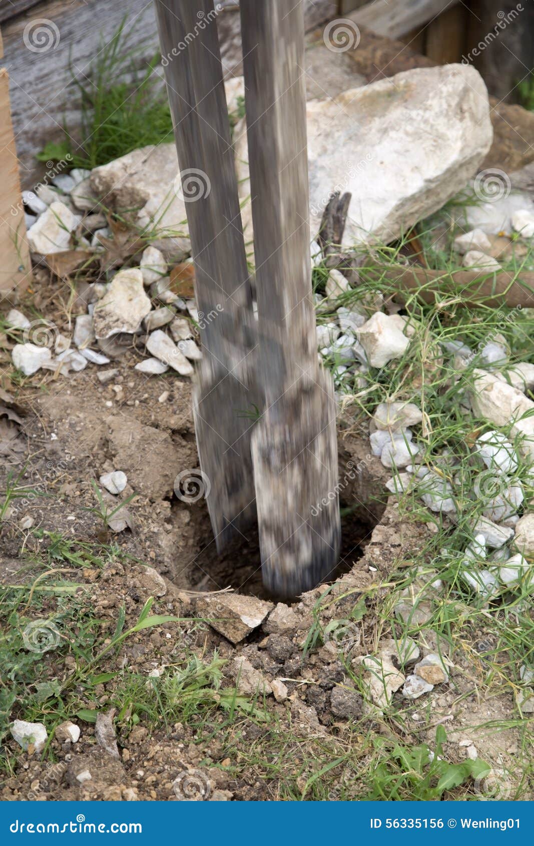 Digging a fence hole stock photo. Image of construction - 56335156