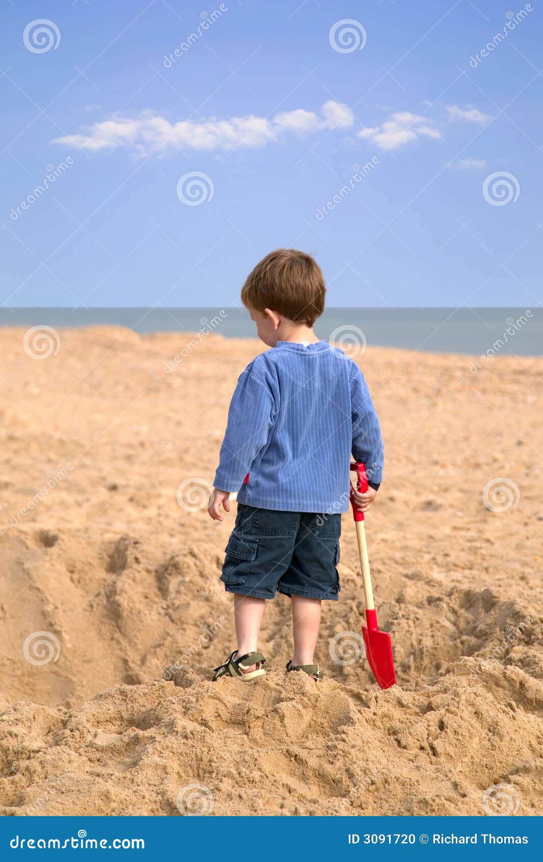 Digging a hole. stock photo. Image of standing, sand, toddler - 3091720
