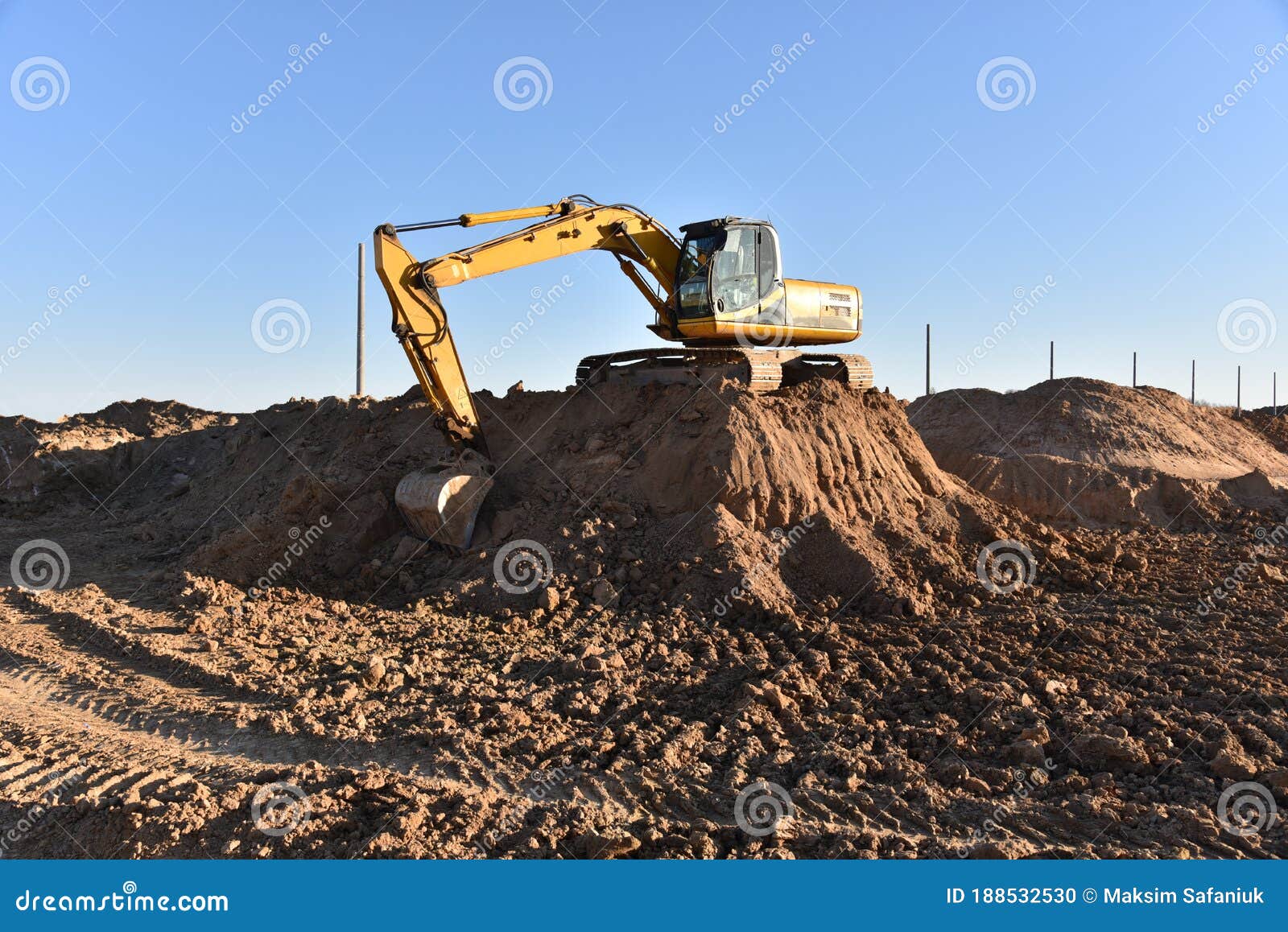 Digging the Pit Foundation a Hole with Excavator. Earthwork in ... Digging the Pit Foundation a Hole with Excavator. Earthwork in ...