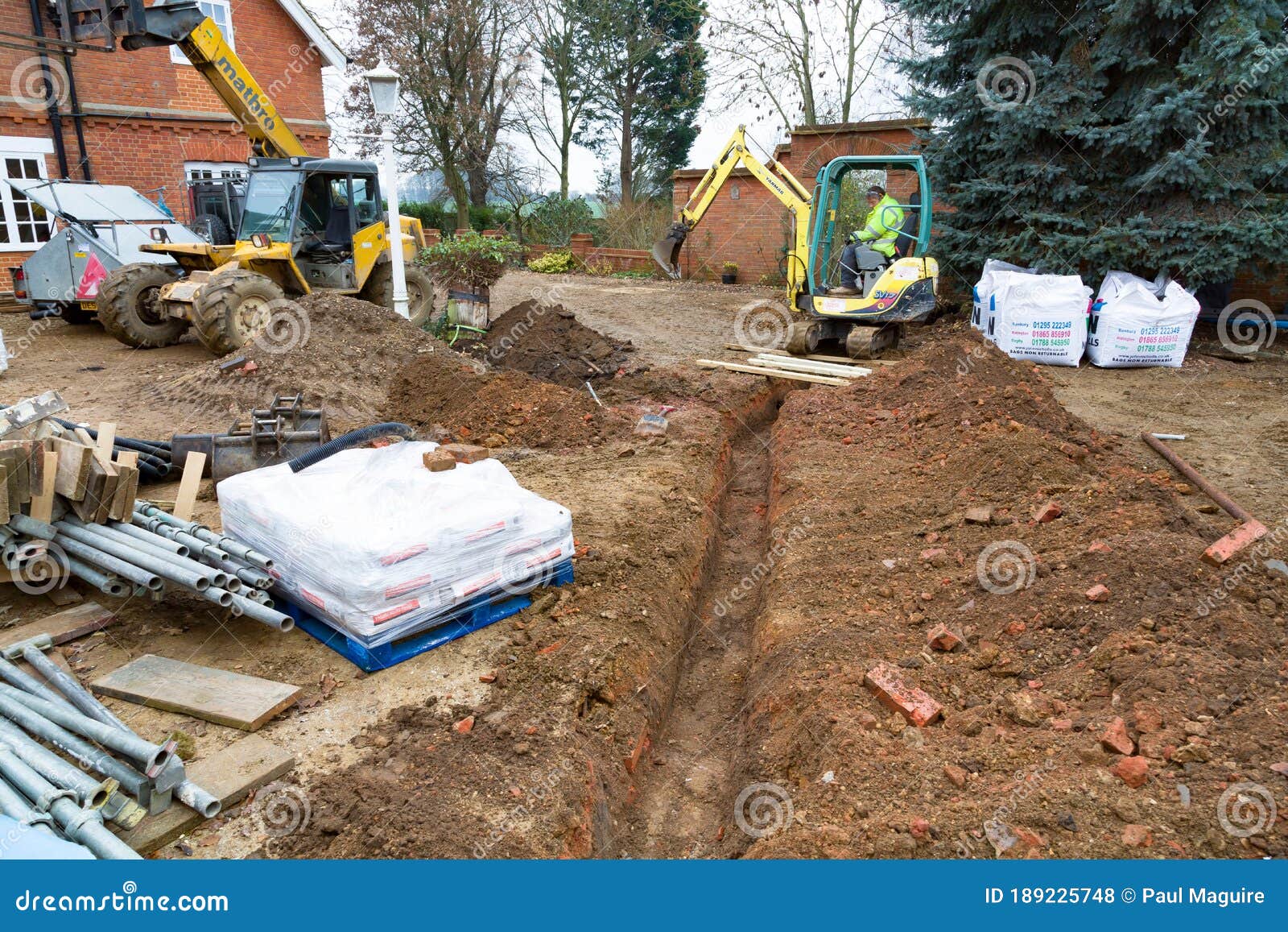 Digging a Trench for Drains, UK Building Site Editorial Stock Photo ...