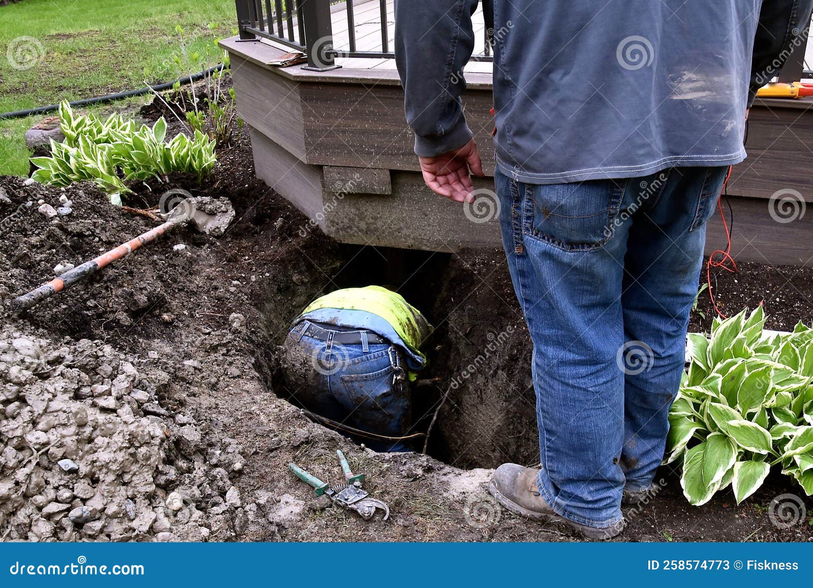 Digging Under a Deck in Search of an Electrical Power Line Stock Image ...