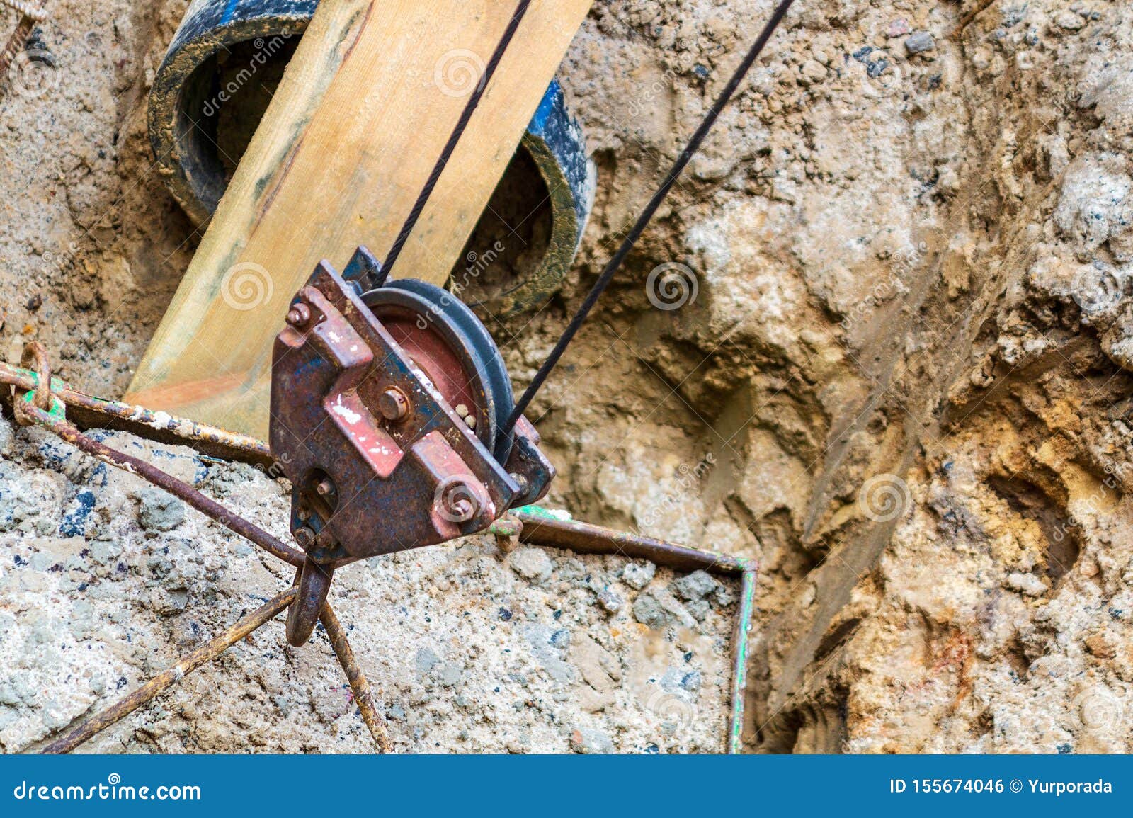 Digging a Well, Crane Hook Lifts the Ground from the Pit Stock Photo ...