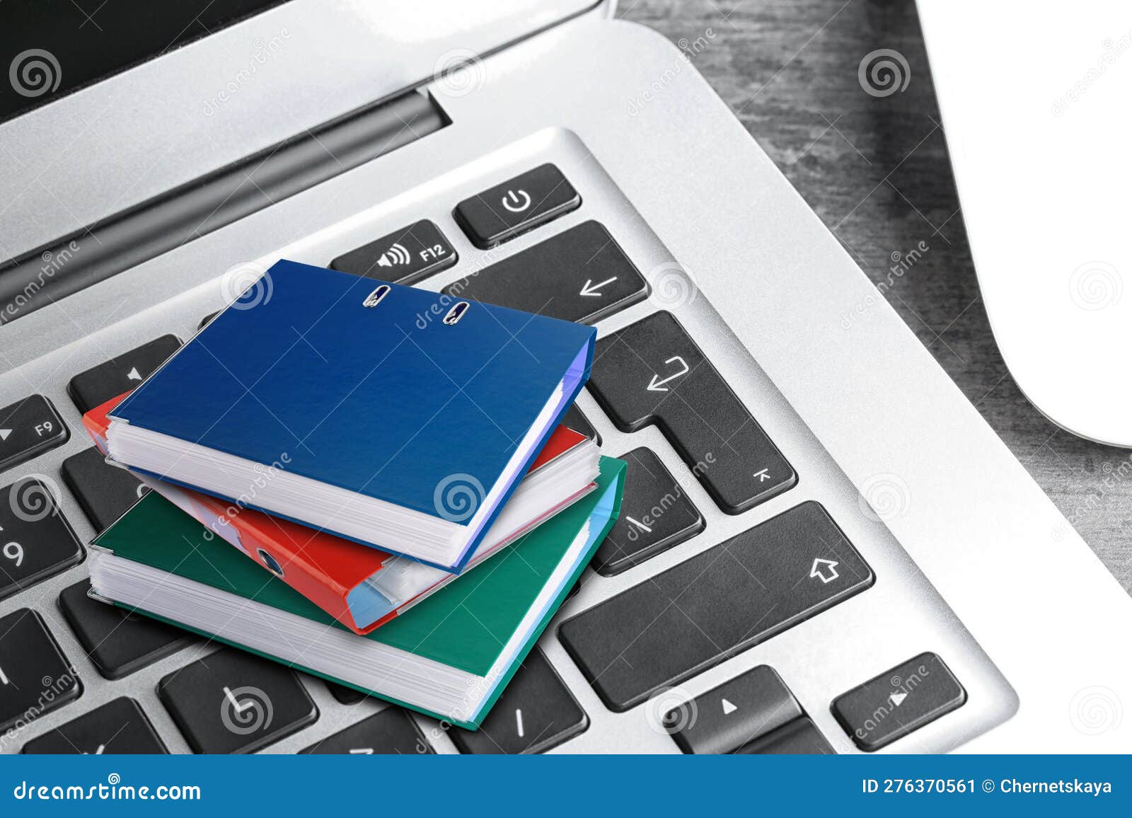 Digital Archive. Laptop Keyboard with Stacked Downsized Folders on ...