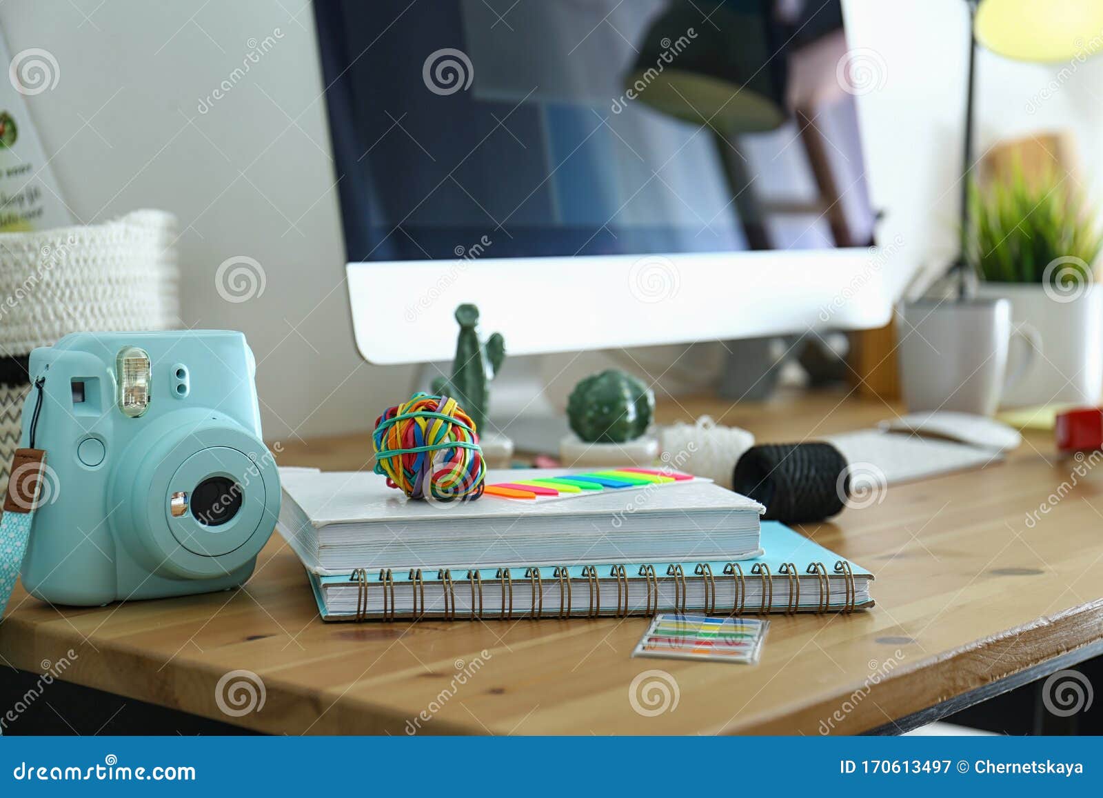 Digital Camera and Notebooks on Table. Modern Designer`s Workplace ...