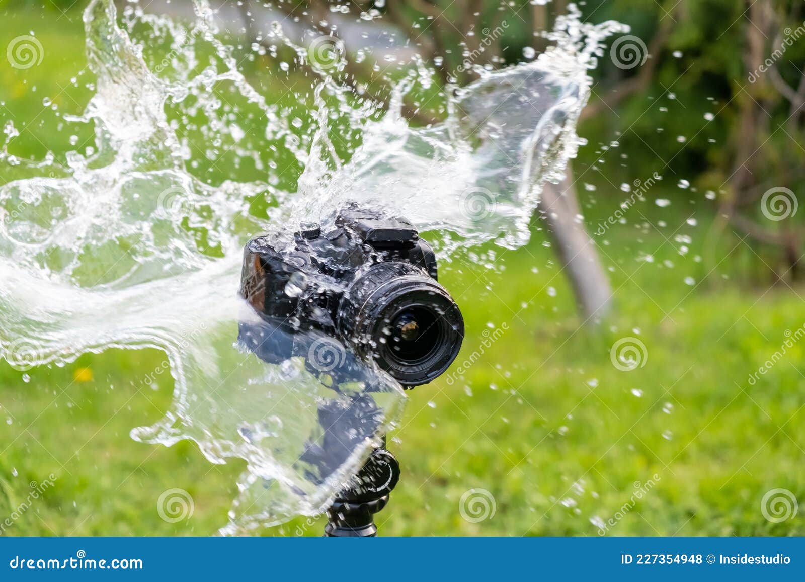A Digital Camera on a Tripod in the Rain Stock Photo - Image of falling ...