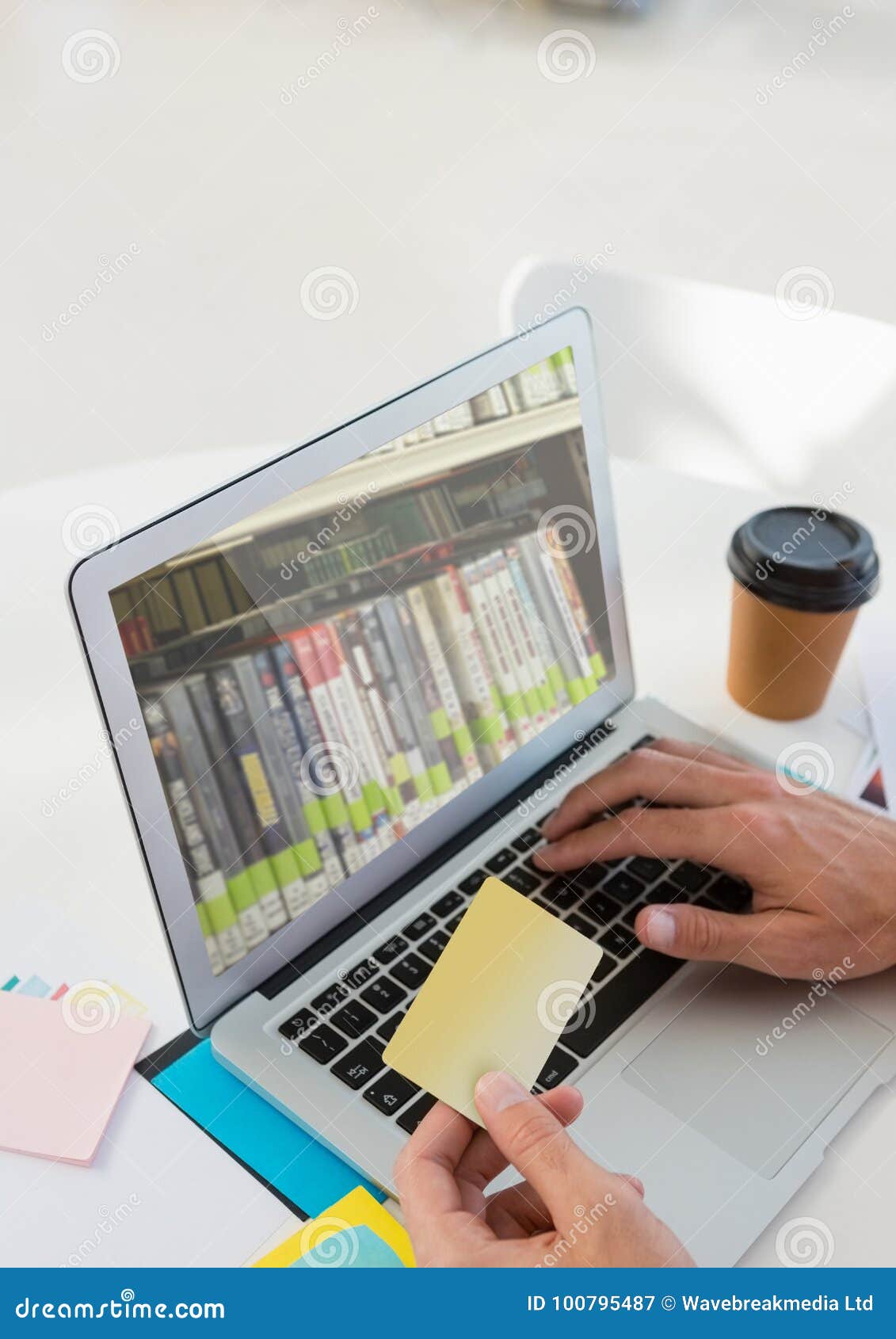 Bookshelf on laptop screen stock image. Image of desk - 100795487