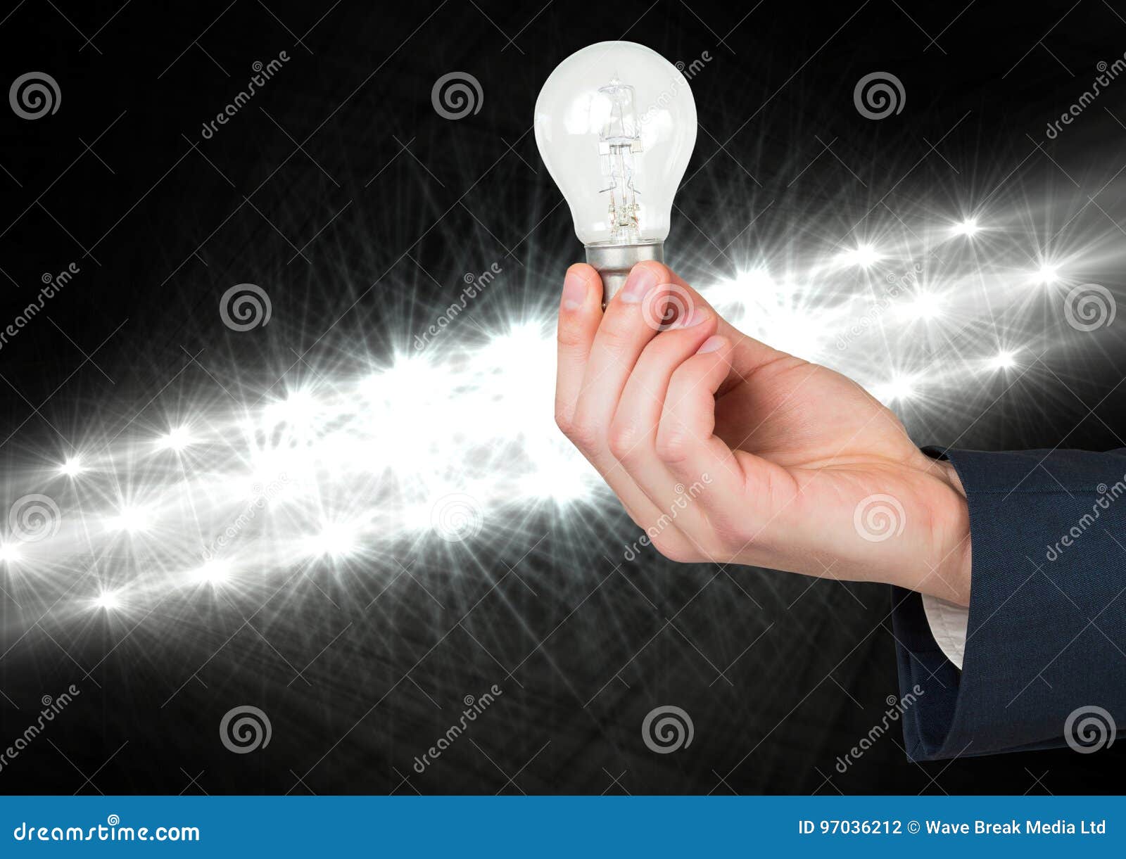 Hand Holding Bulb in Front Bright Lights and Darkness Stock Photo ...