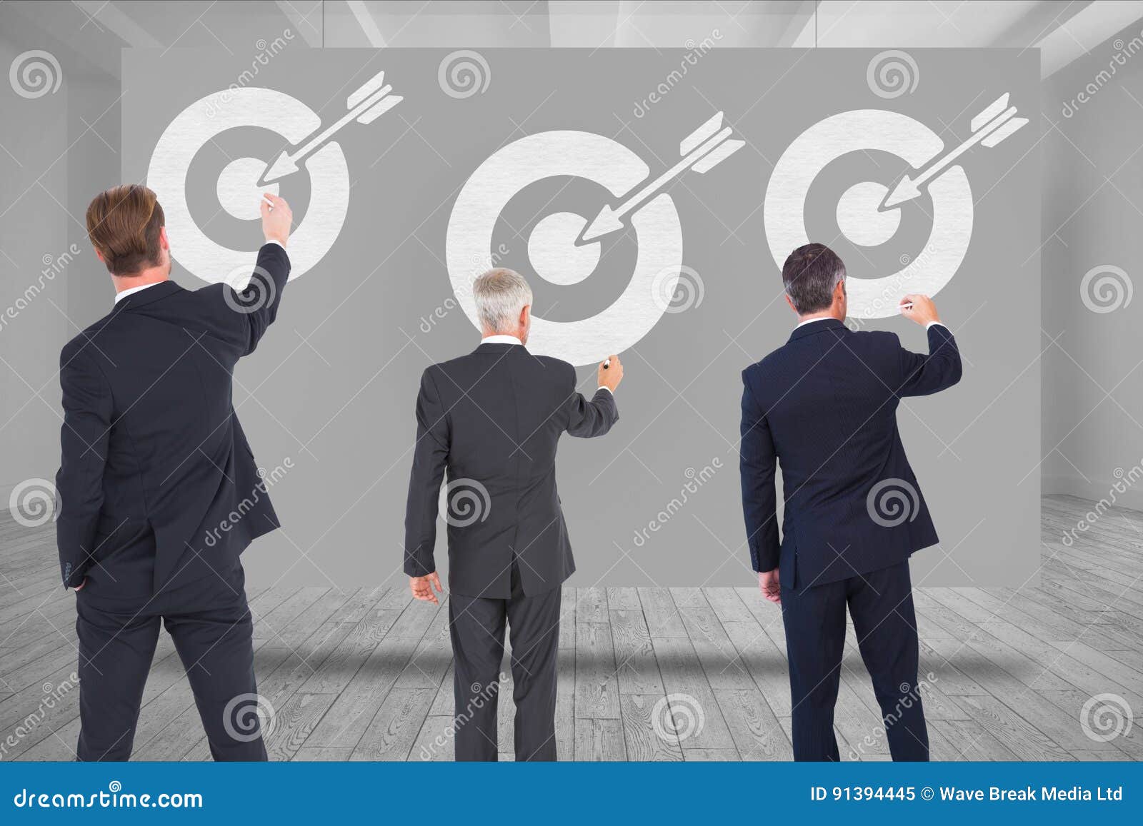 Digital Composite Image of Business People Drawing Arrow with Target ...