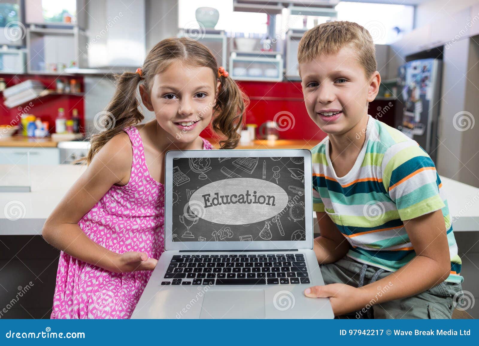 Kids Looking at a Computer with School Icons on Screen Stock Image ...