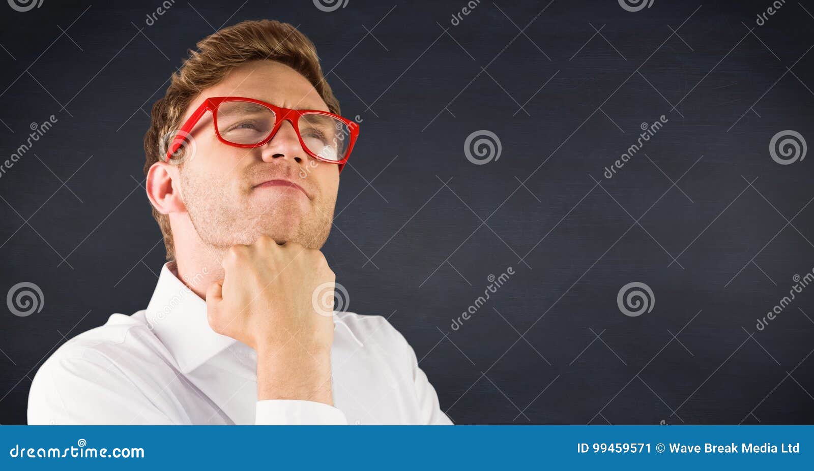 Nerd Man Thinking Against Navy Chalkboard Stock Image - Image of ...