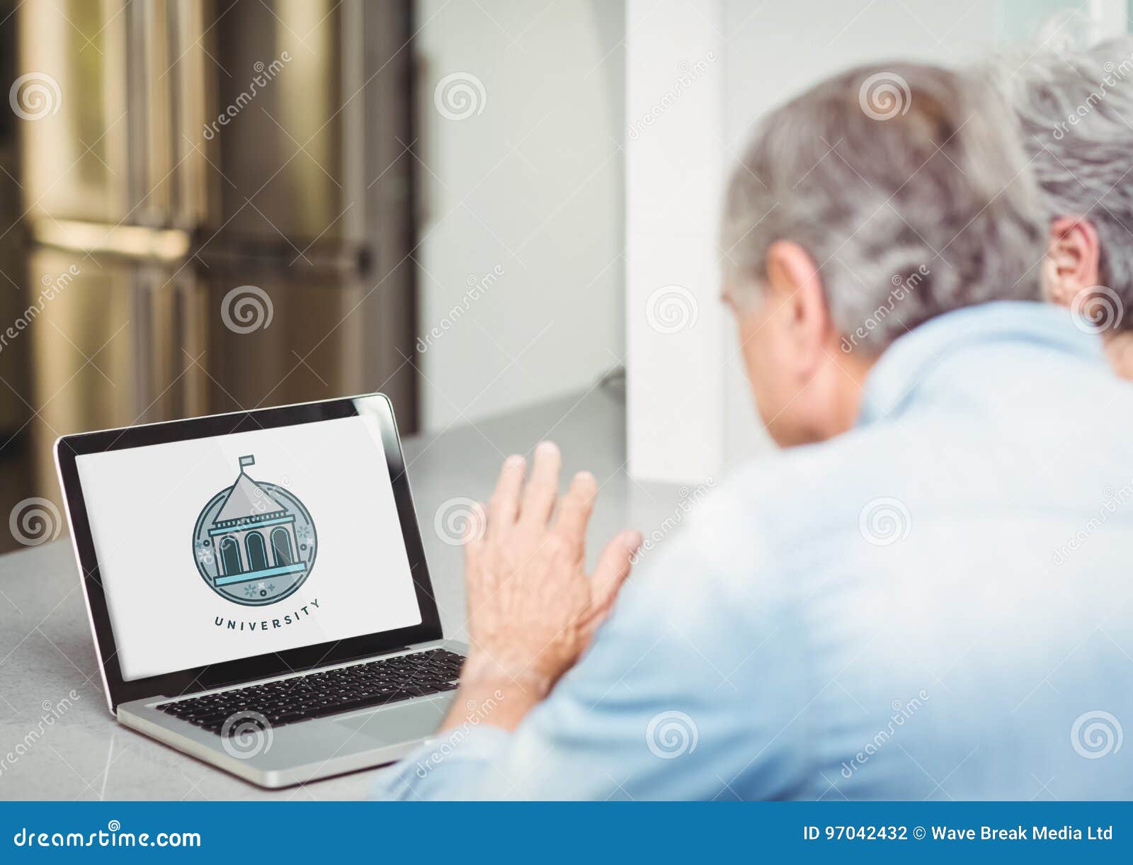 People Looking at a Computer with Education Icon on the Screen Stock ...