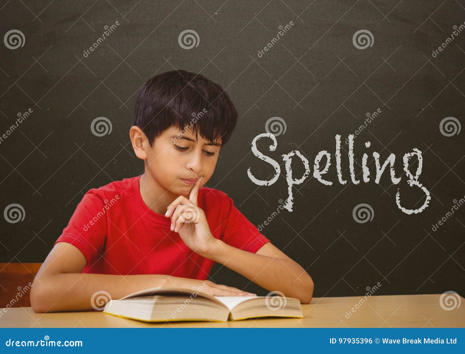 Student Boy at Table Against Grey Blackboard with Spelling Text Stock ...