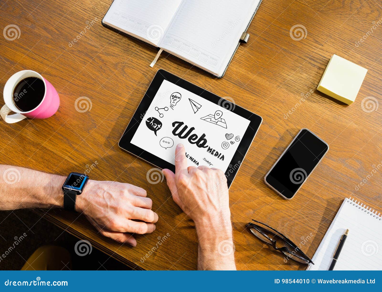 Table Top with a Tablet with Web Graphics on the Screen Stock Photo ...