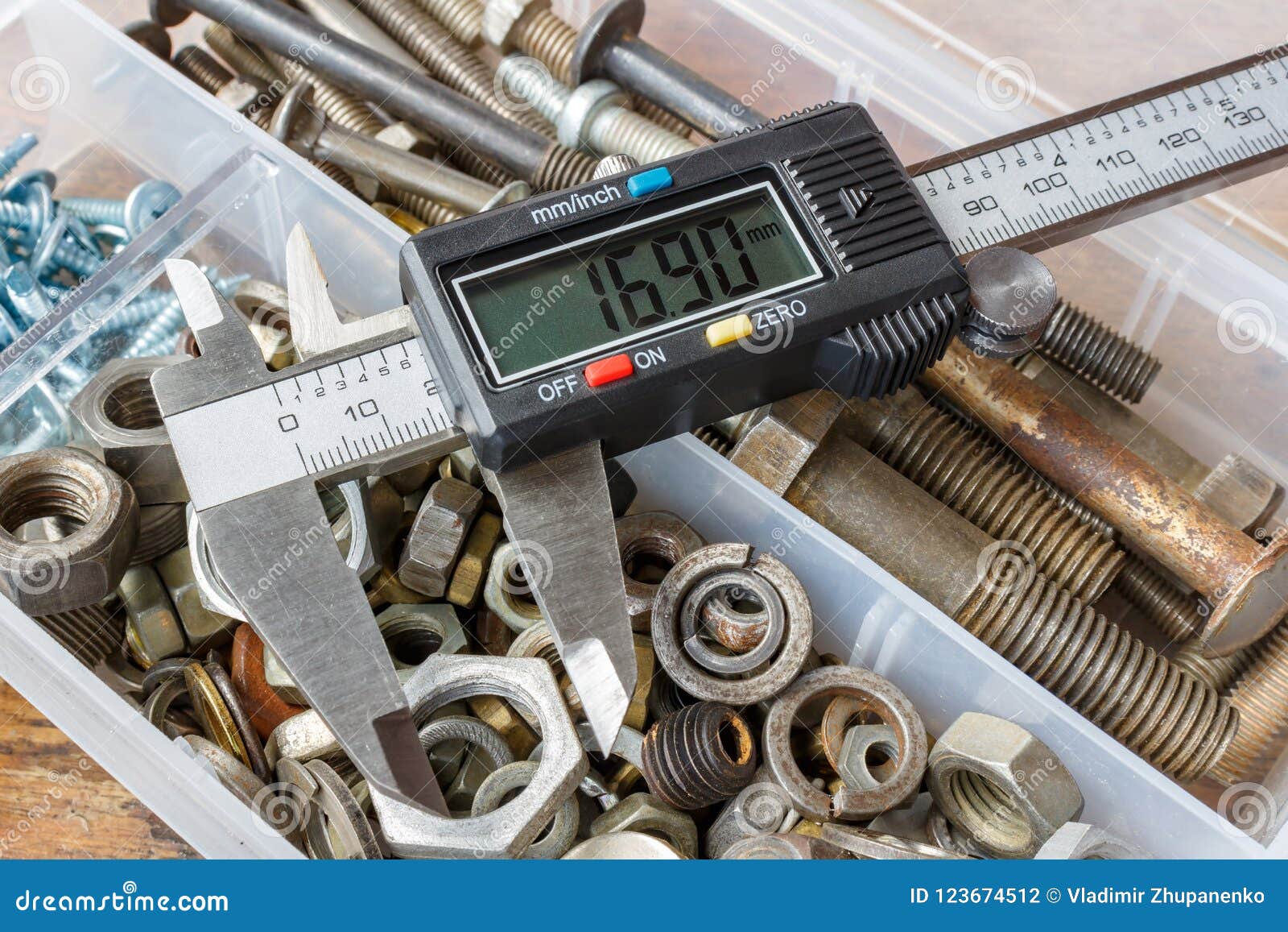 Digital Electronic Caliper on a Background of Opened Storage Box with ...