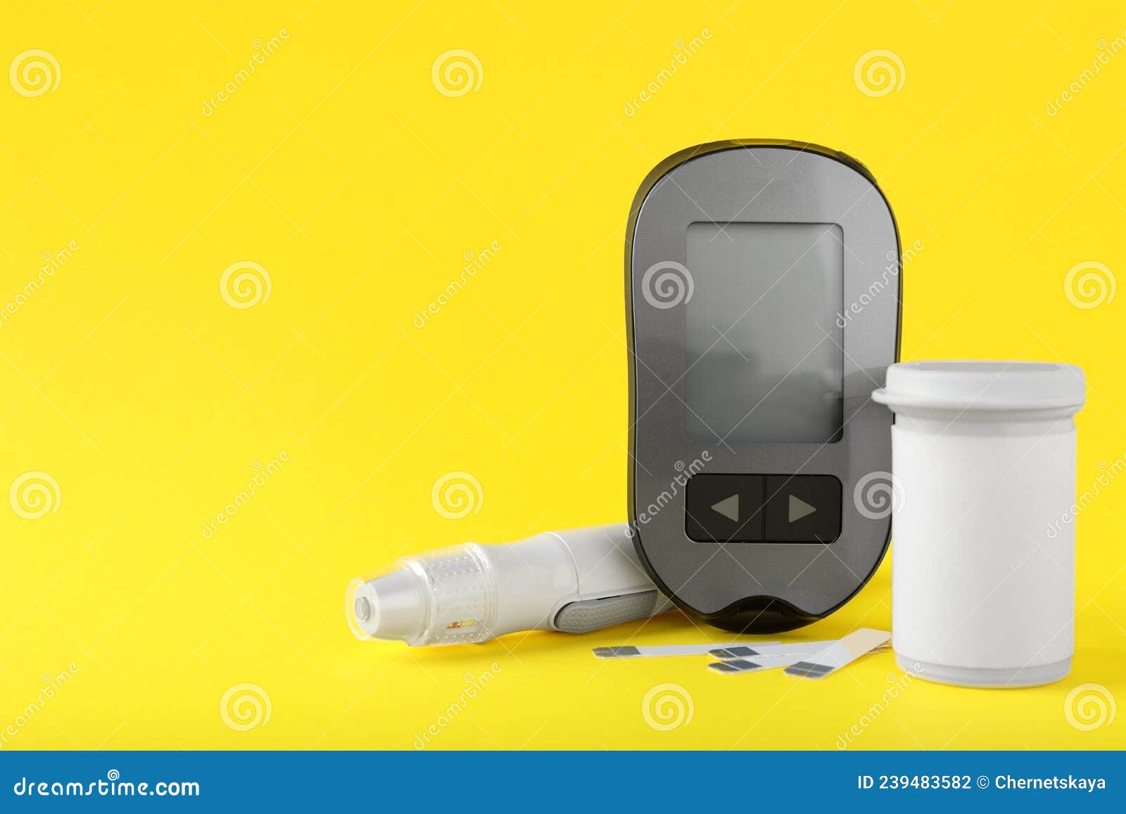 Digital Glucometer, Lancet Pen, Container and Test Strips on Yellow ...