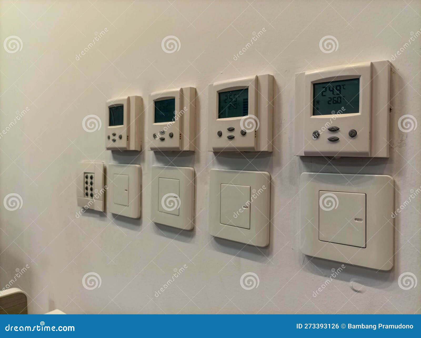 Digital Light Remote Control for Room Light Settings on a White Wall ...