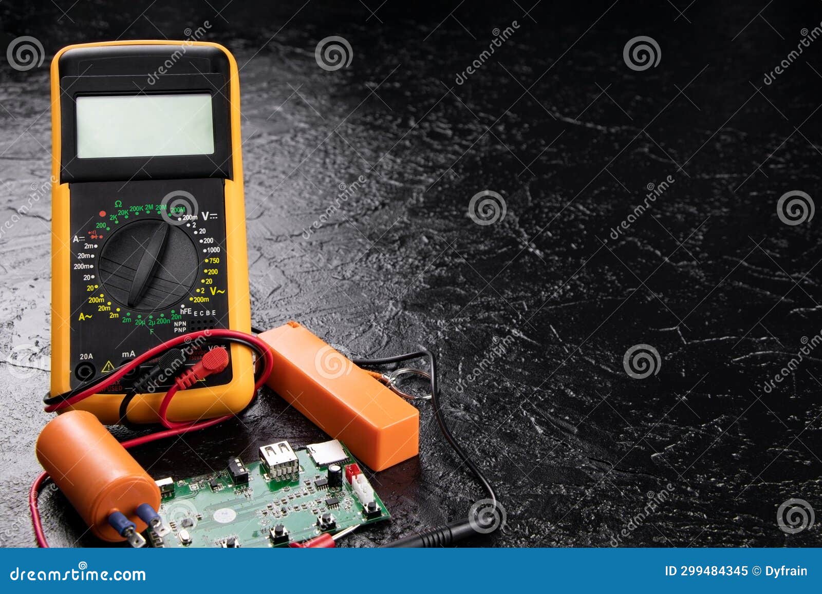 Digital Multi-meter with Probes on a Black Stone Background ...