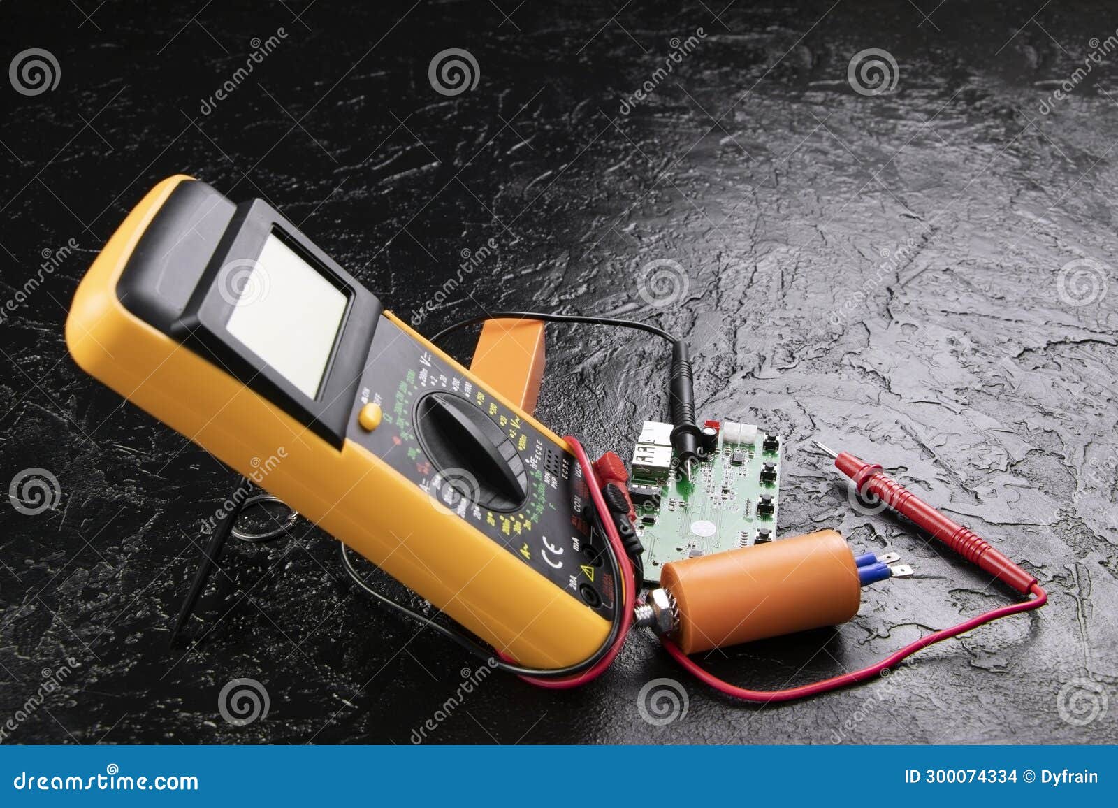 Digital Multi-meter with Probes on a Black Stone Background ...