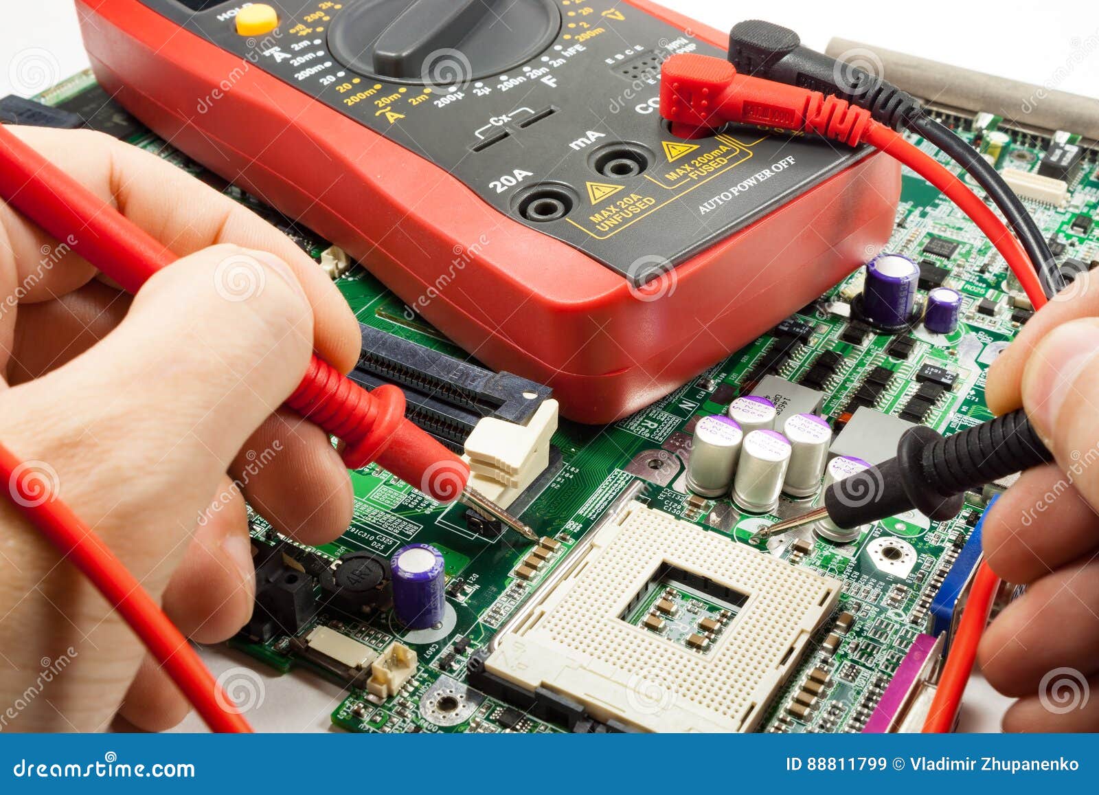 Digital Multimeter with Probe in the Master`s Hands in a Workshop Stock ...
