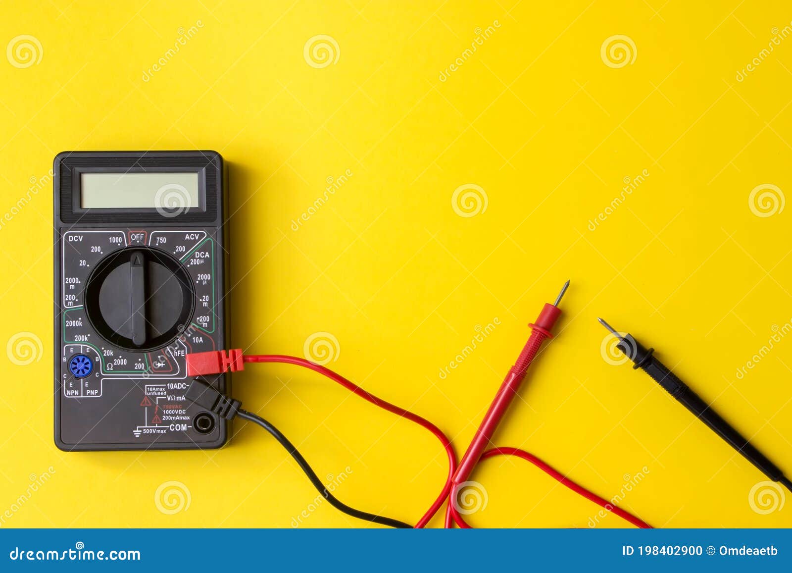 Digital Multimeter with Probes and Backlit Display on a Yellow ...