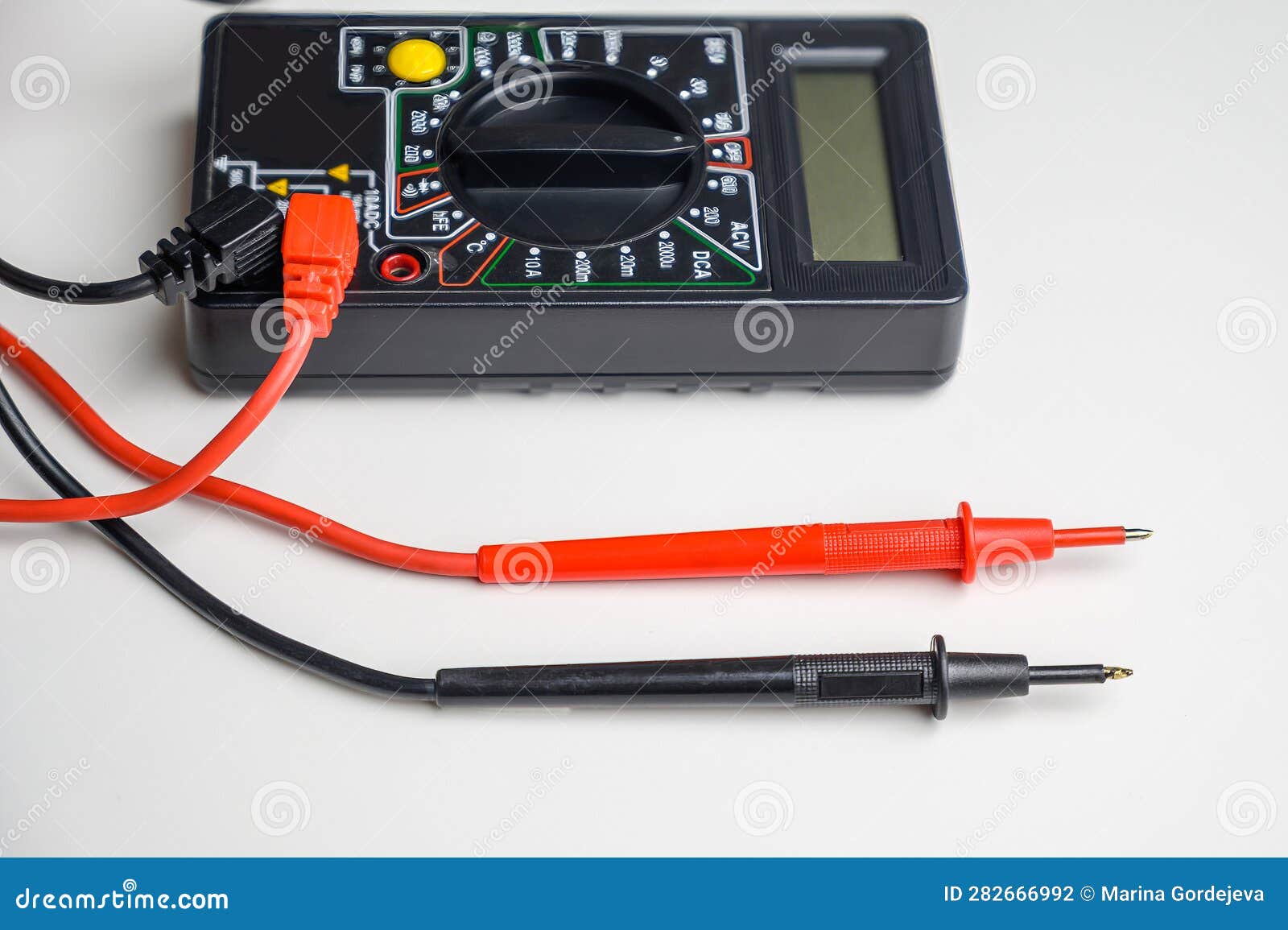 Digital Multimeter with Test Leads on a White Table. a Multimeter is an ...