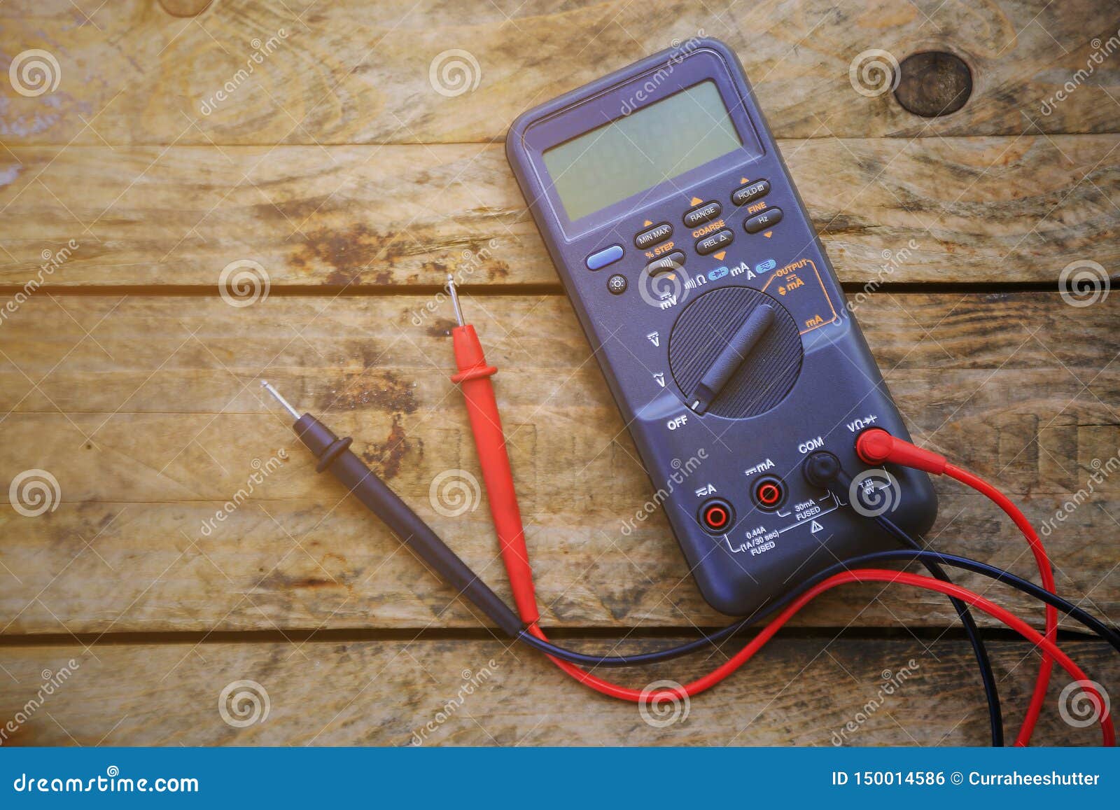 Digital Multimeter and Wiring on Wooden Table. Special Tools of ...