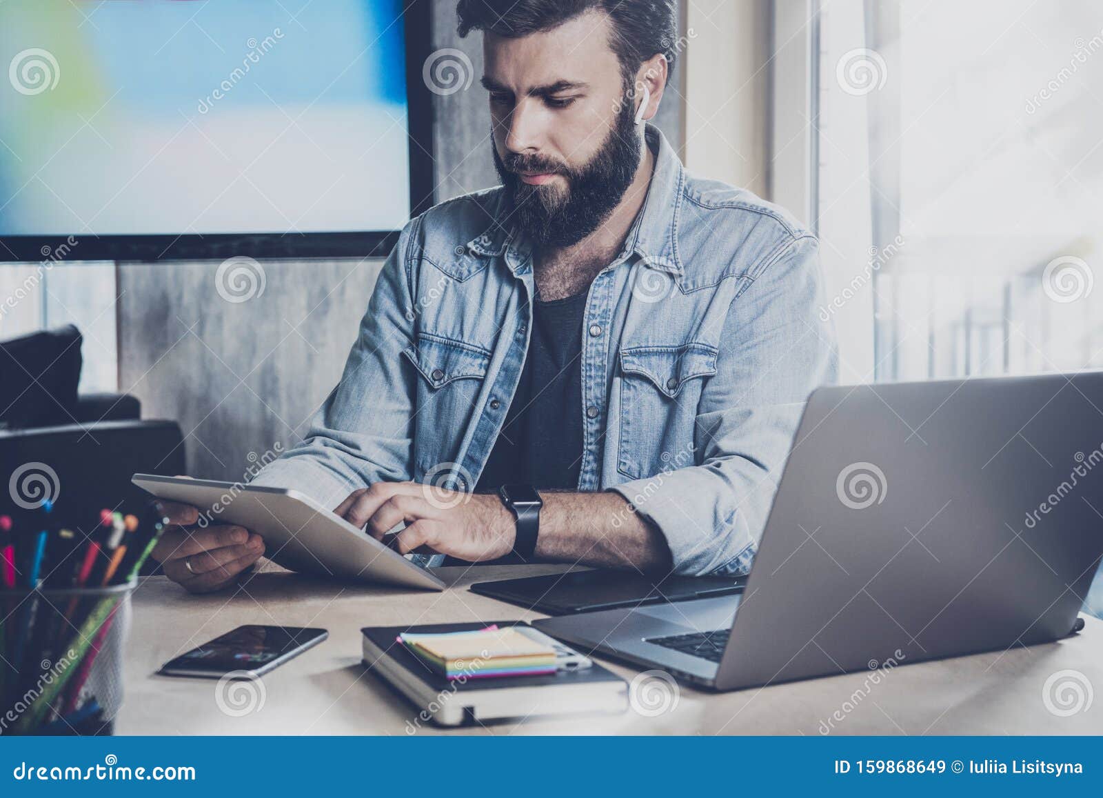 Digital Specialist Sitting at Desk and Working on Project Using ...