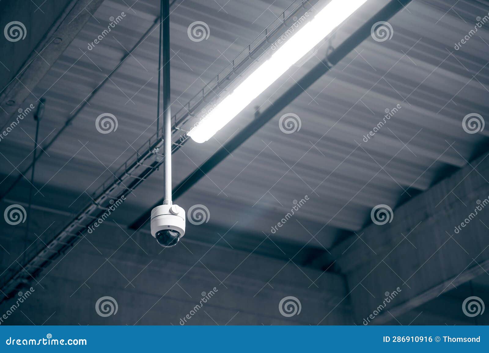 Digital Surveillance Camera on the Ceiling in a Warehouse Room Stock ...