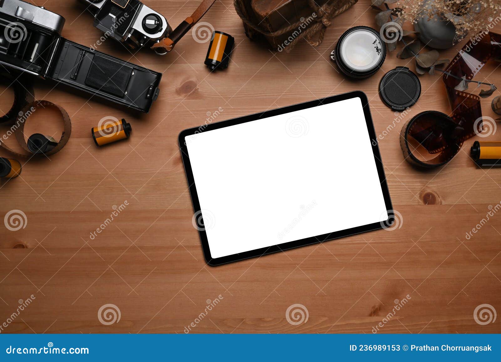 Digital Table with White Screen and Retro Camera on Wooden Table. Stock ...