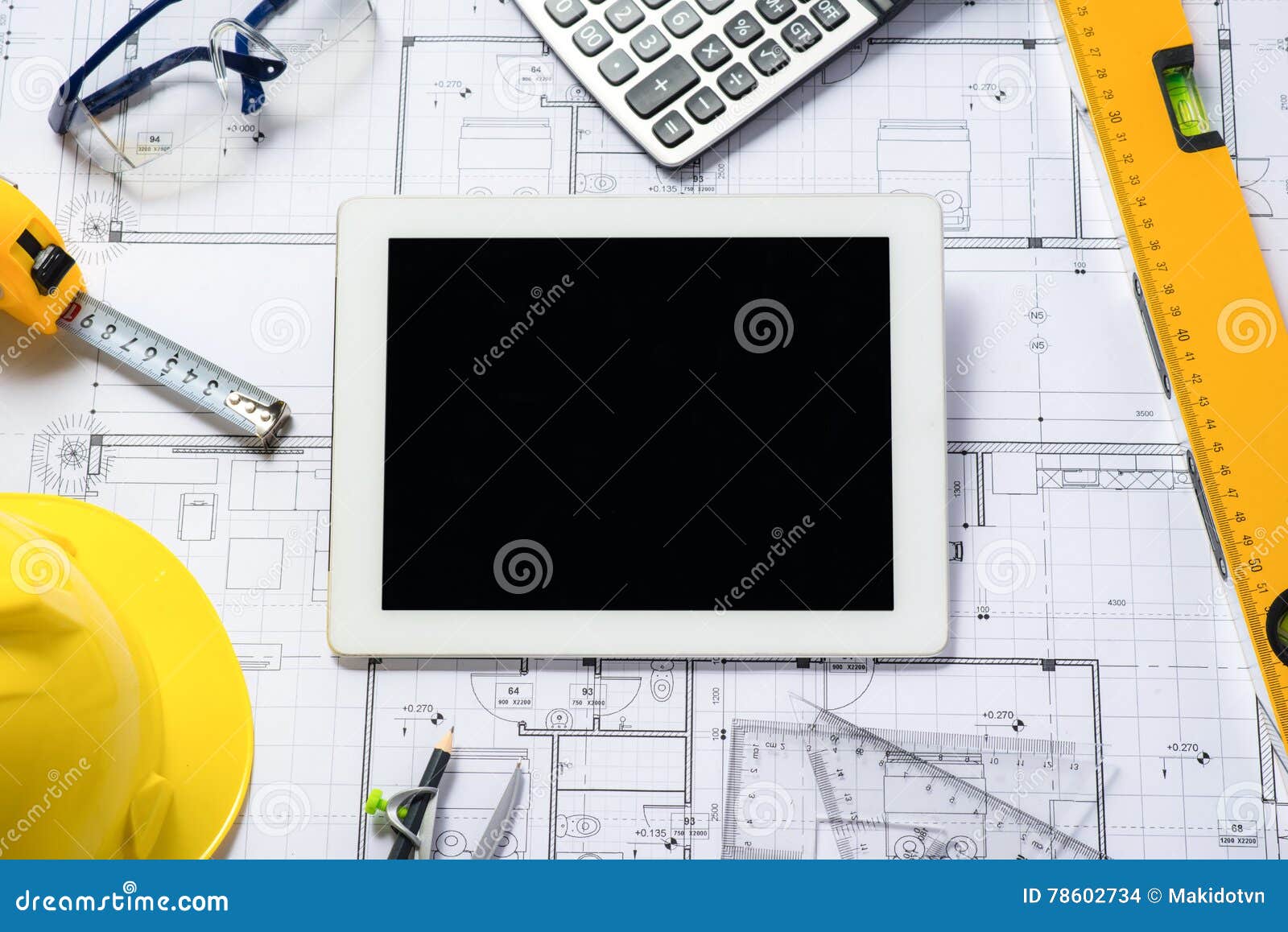 Digital Tablet with Architectural Blueprints Rolls and Tools. Stock ...