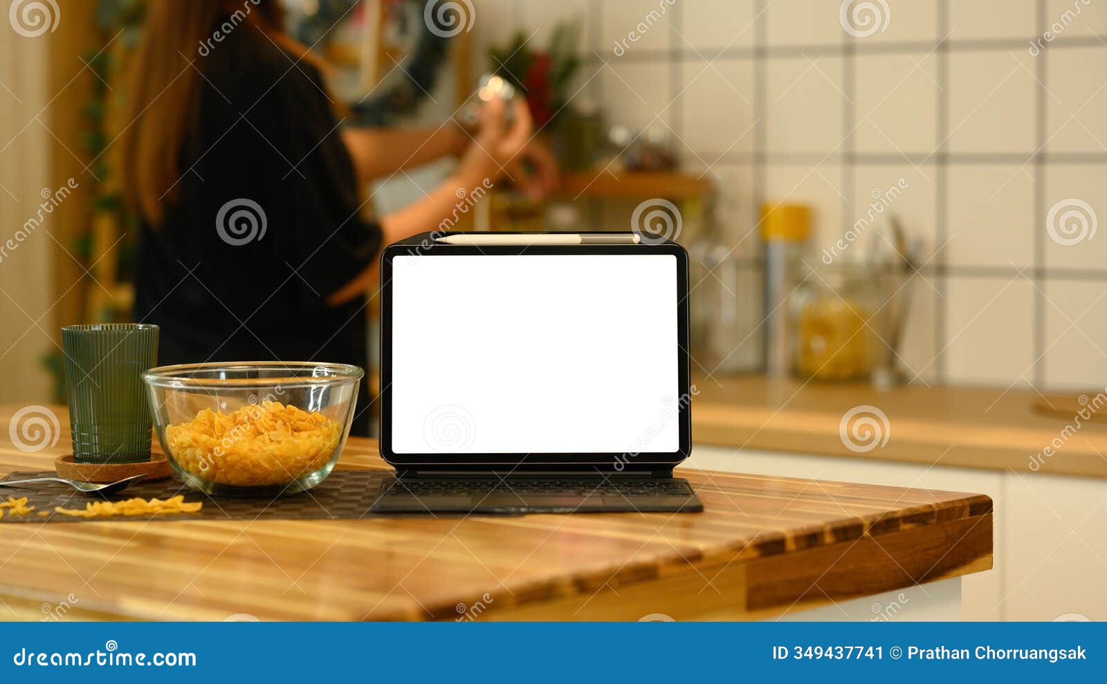Digital Tablet with a Blank Screen on a Kitchen Counter Next To a Bowl ...