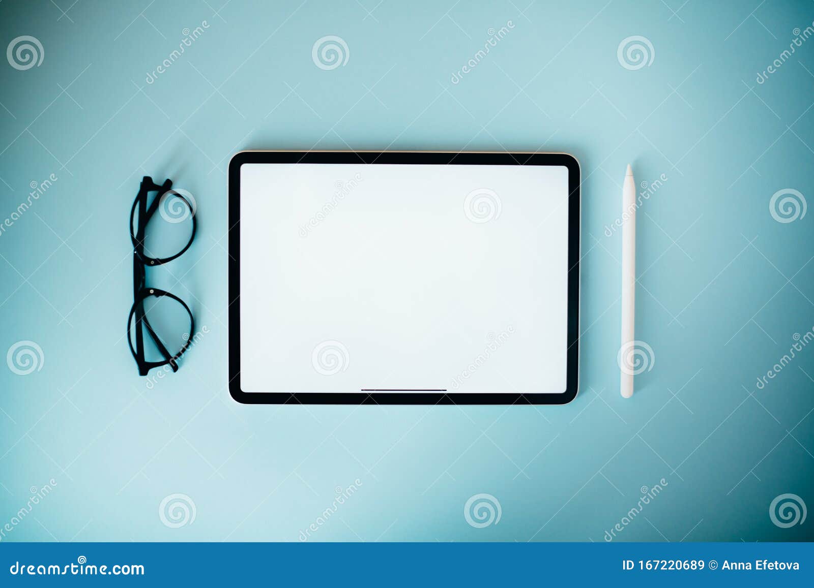 Digital tablet on blue stock image. Image of computer - 167220689