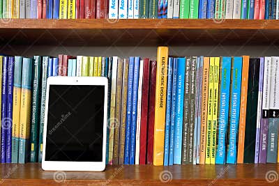 Digital Tablet on the Books Shelves Editorial Stock Image - Image of ...