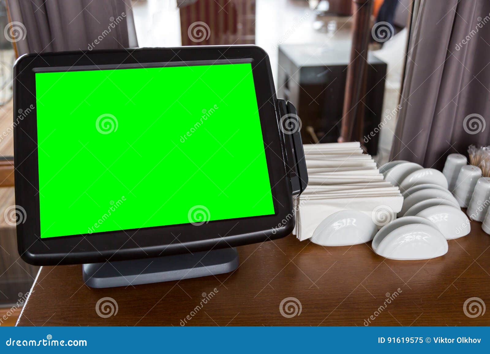 Digital Tablet Computer Green Screen in a Cafe on the Table. Stock ...
