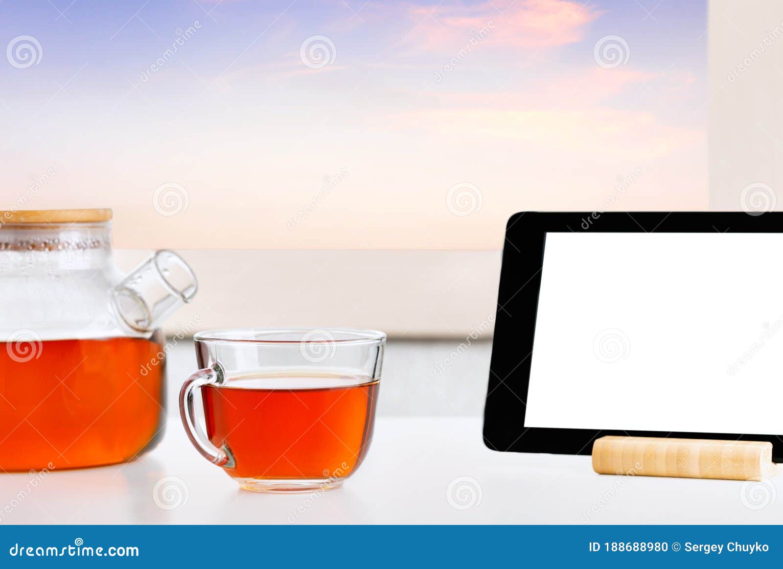 Digital Tablet and Cup of Tea on Table Near Window. Stock Photo - Image ...